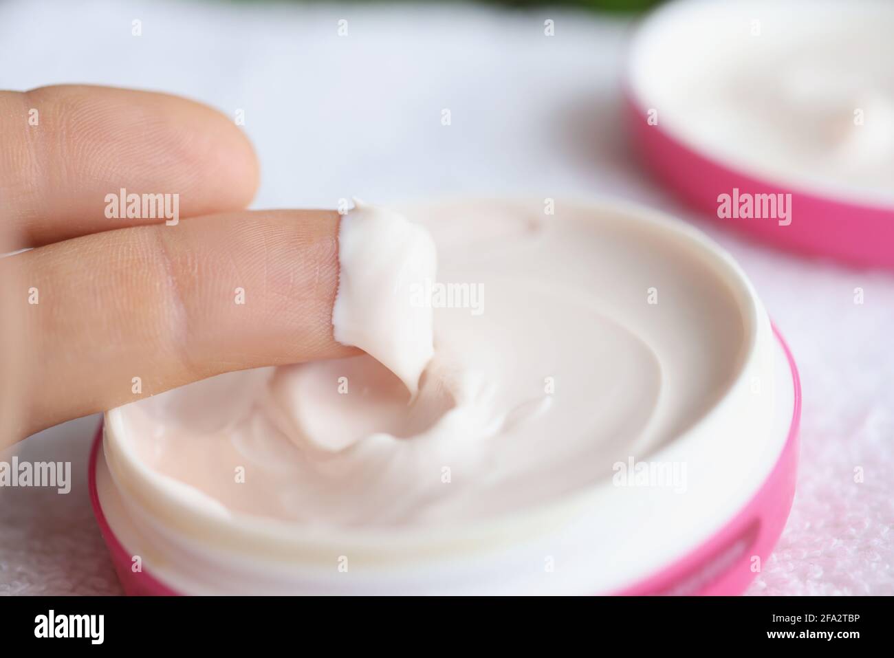 Cream on fingers hi-res stock photography and images - Alamy