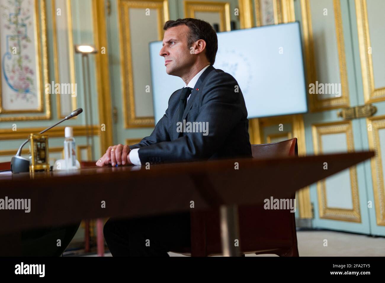 French President Emmanuel Macron listens to US President Joe Biden (on ...