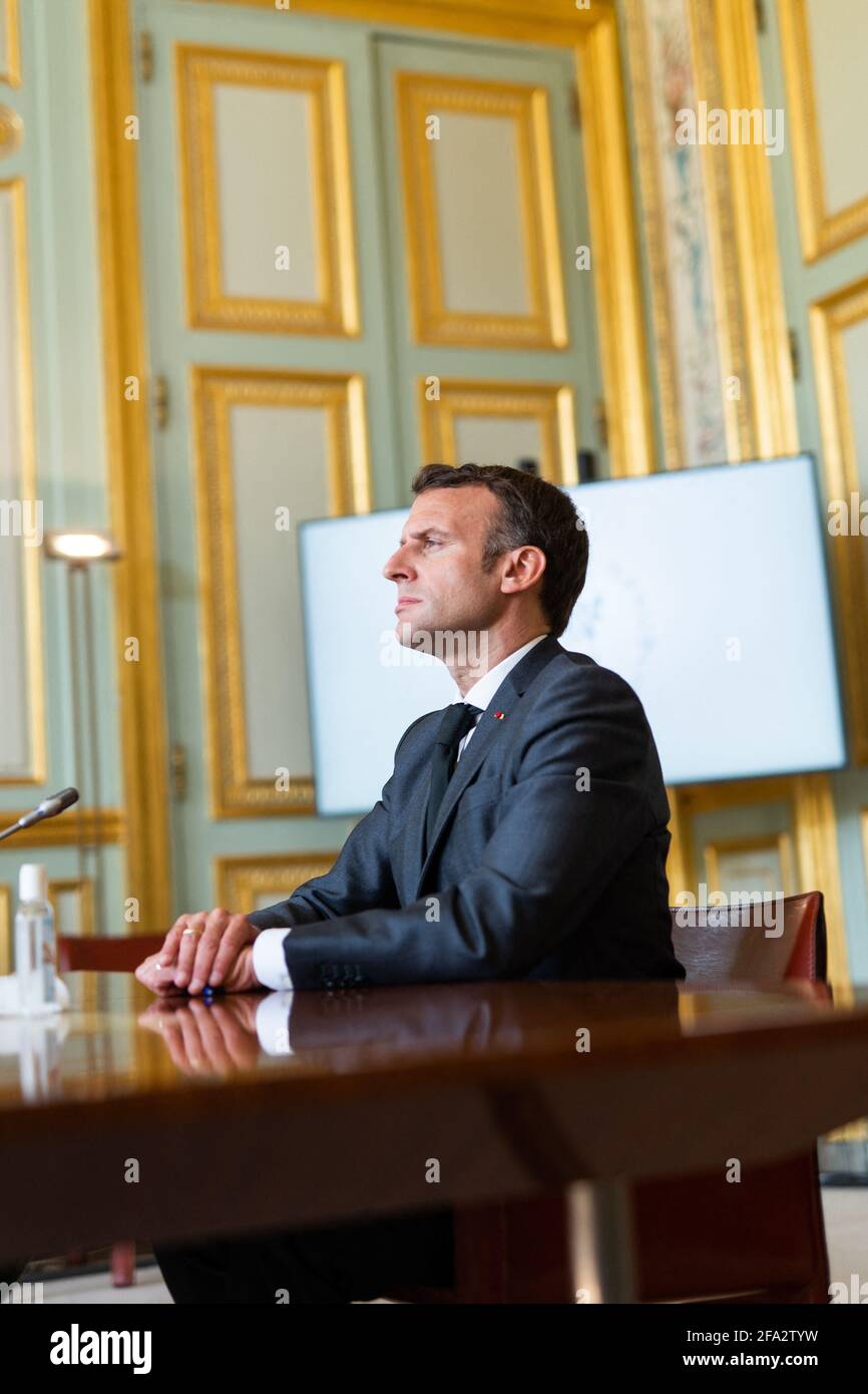 French President Emmanuel Macron listens to US President Joe Biden (on ...