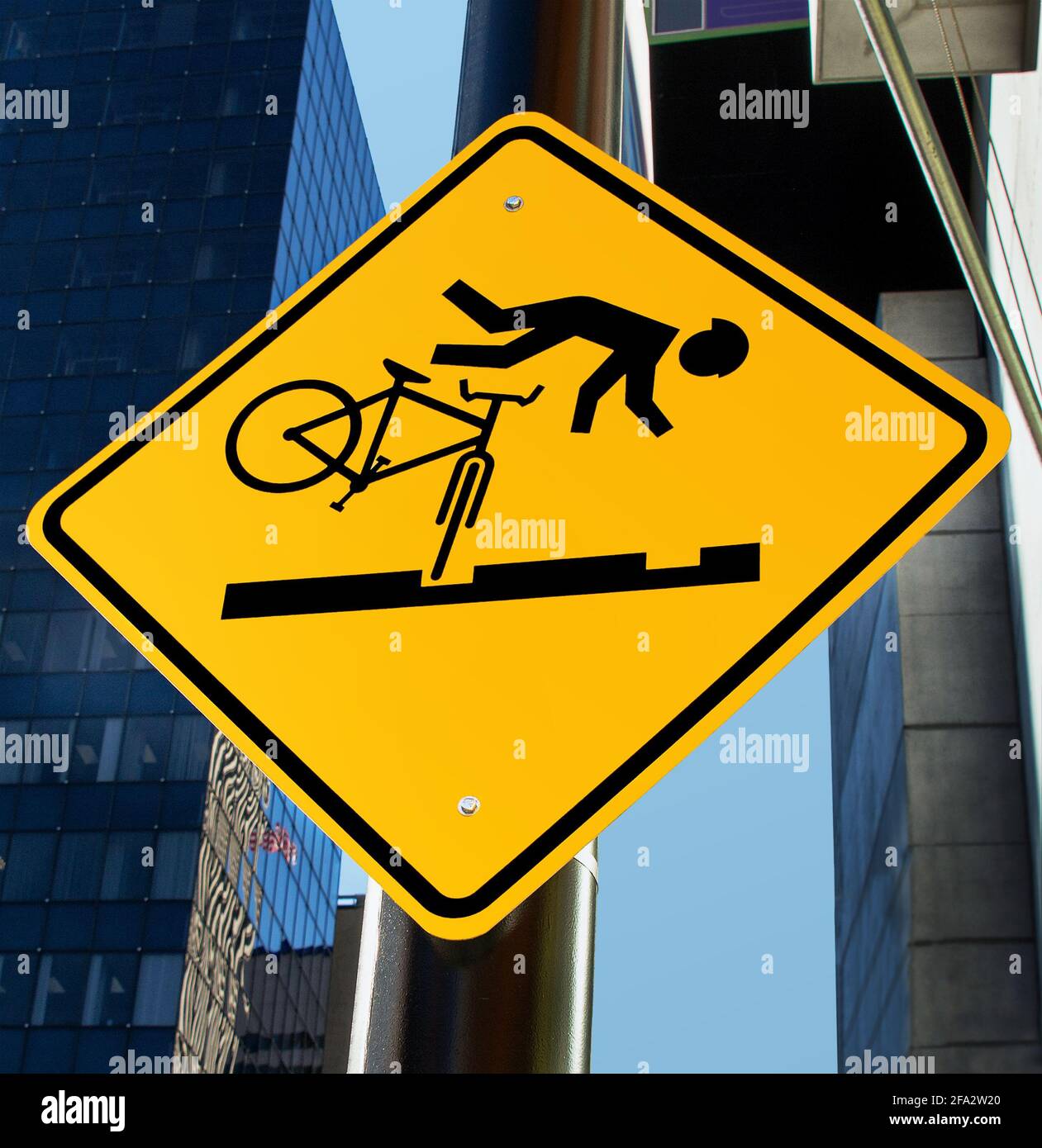 Bicycle danger sign warns of streetcar tracks. Narrow bicycle tires can ...
