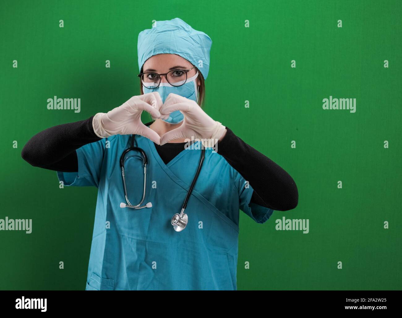 Female doctor forms the shape of a heart Stock Photo - Alamy