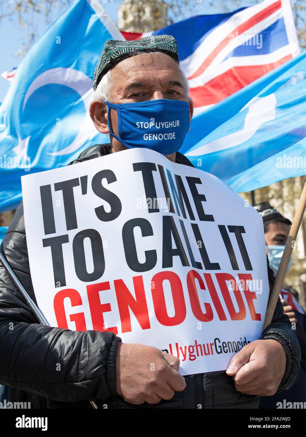 People from the Uyghur Solidarity group protest outside the Houses of ...