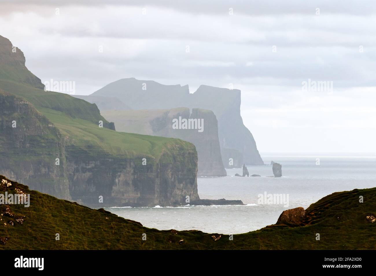 Famous Risin og Kellingin rocks and cliffs Stock Photo - Alamy