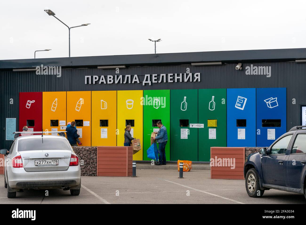 Large color-marked separate waste disposal station near the parking lot ...
