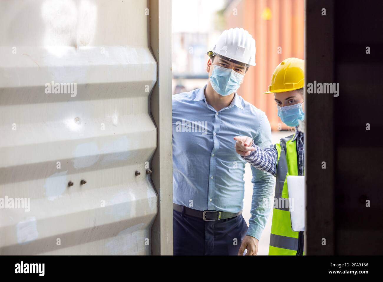 Industrial worker woman and engineer control worker checking in front ...