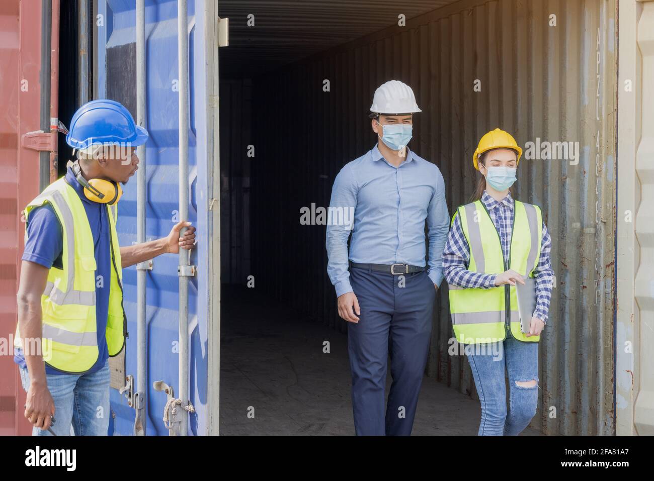 Industrial worker woman and engineer control worker checking in front ...