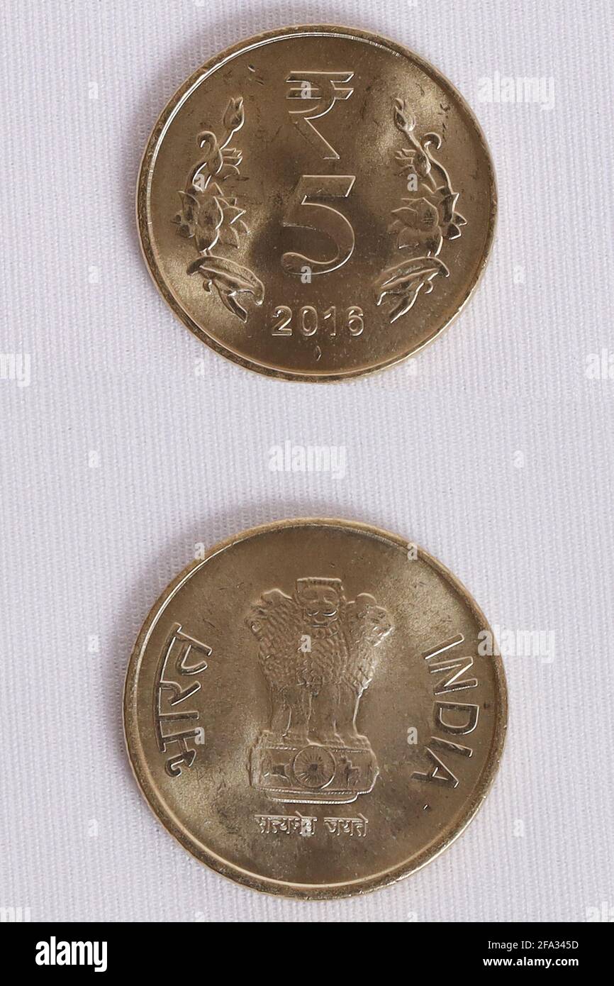 Vertical shot of Indian five rupees coins isolated on white background ...