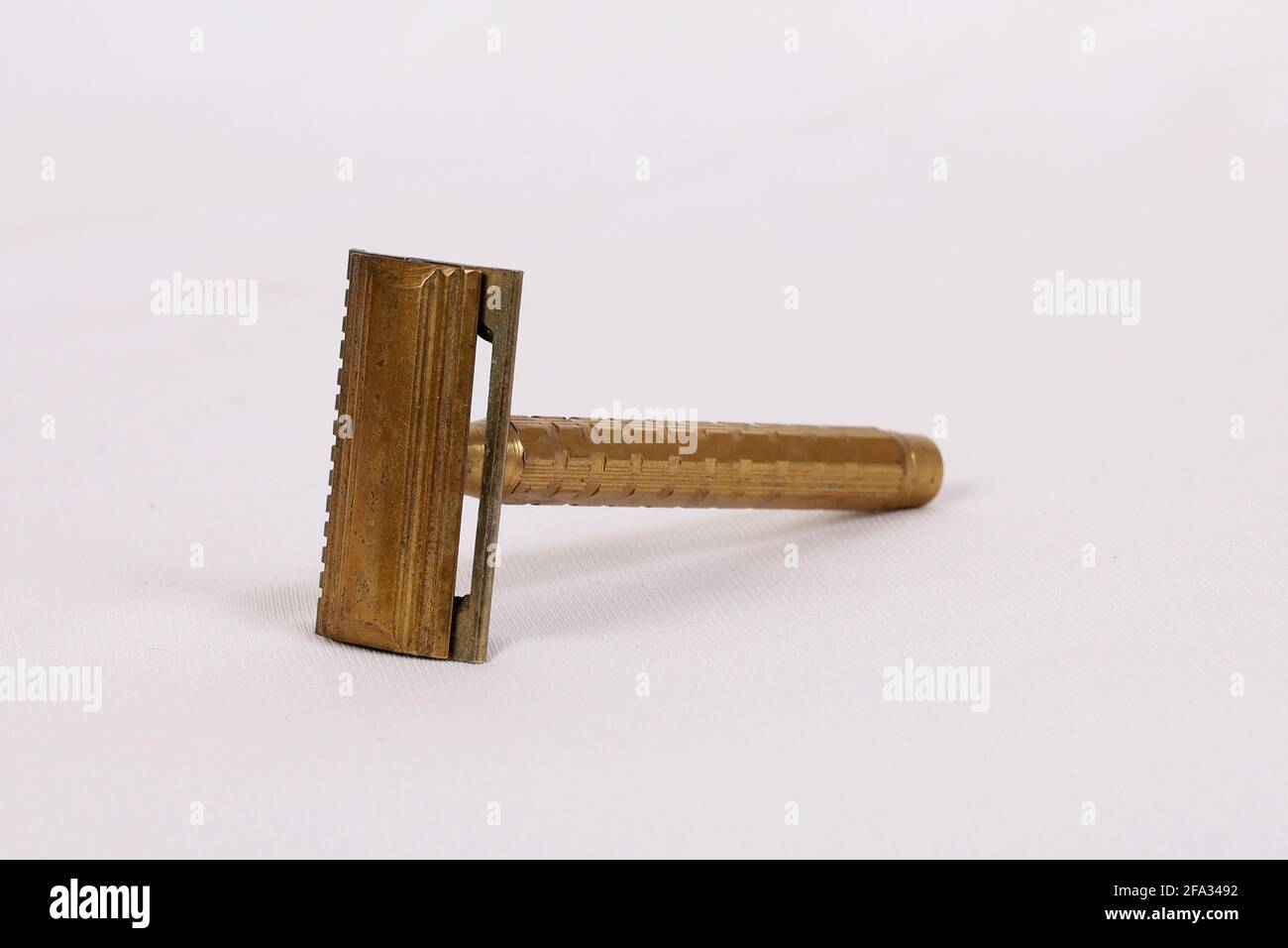 Golden vintage razor isolated on white background Stock Photo - Alamy