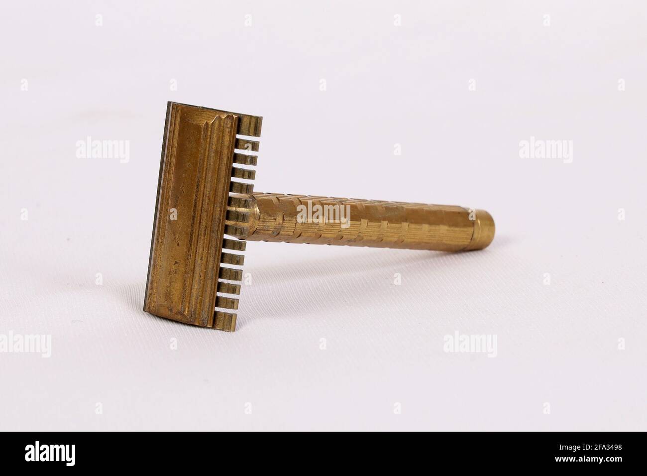 Golden vintage razor isolated on white background Stock Photo - Alamy