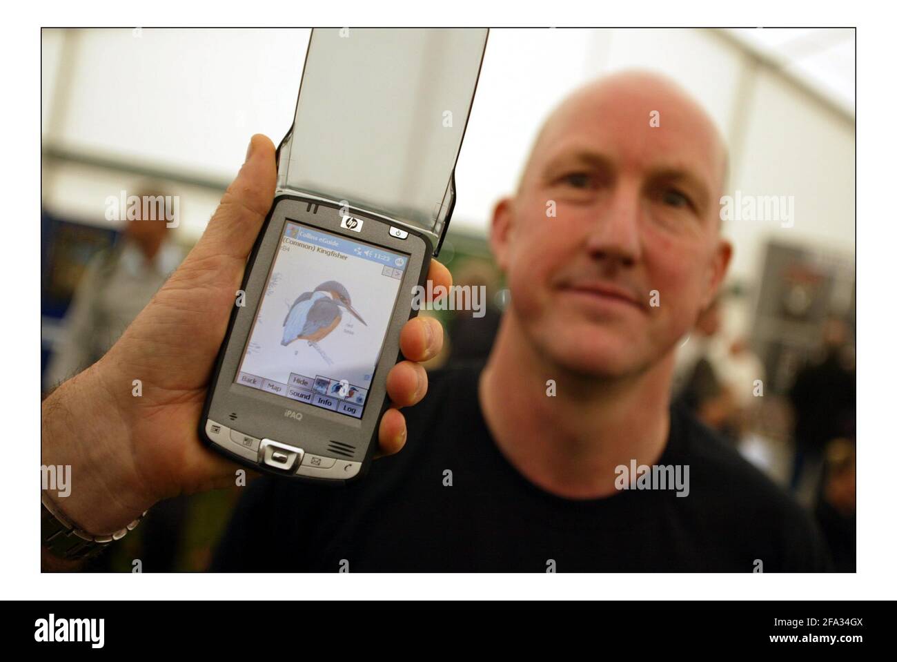 Duncan Macdonald with the Collins Bird e-guide on a P.D.A. launched at ...