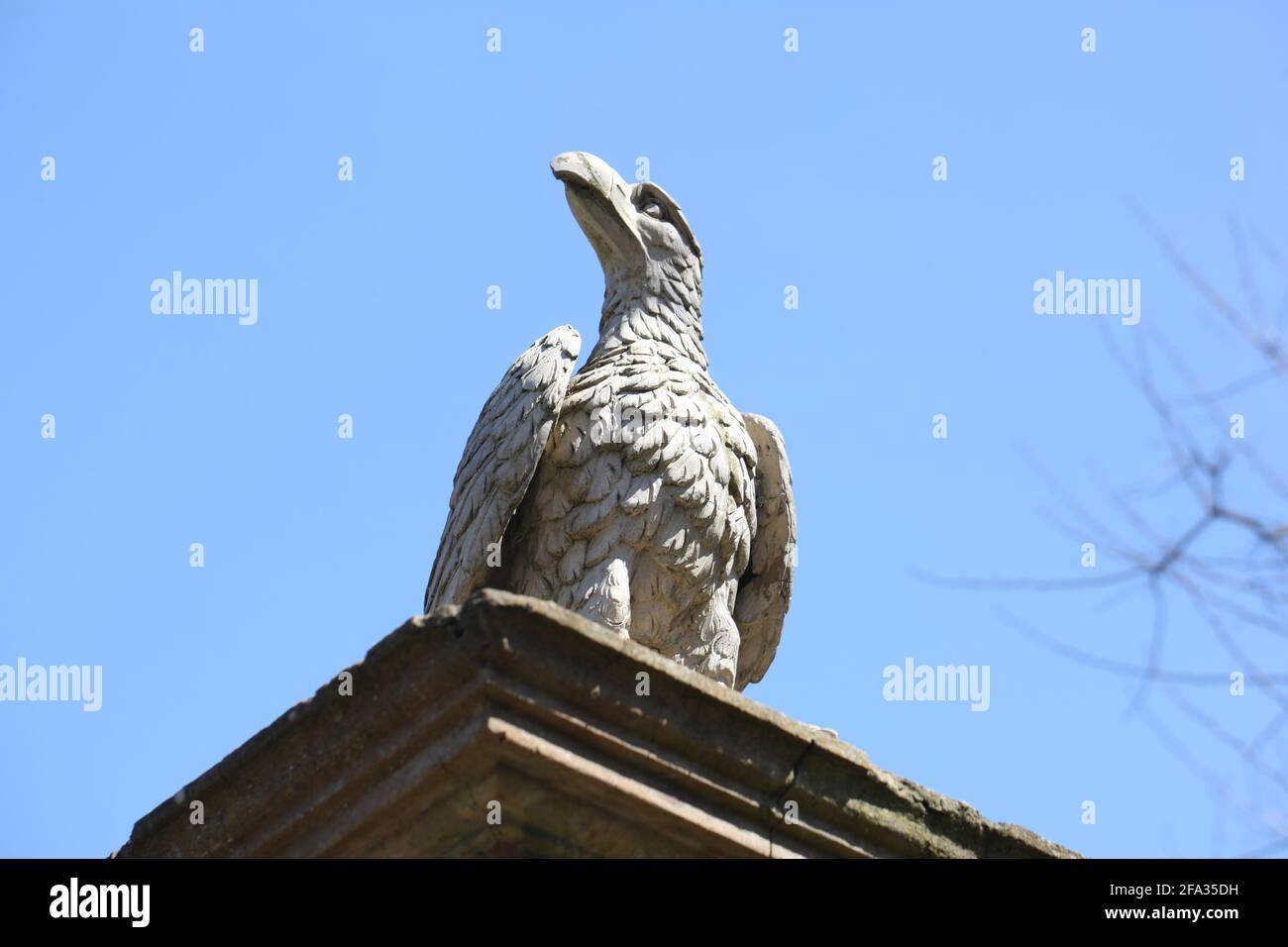 A Victorian stone eagles mounted on red-brick pillar at entrance to ...