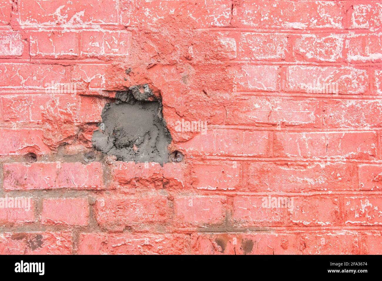 Old pink and red painted brick wall facade texture with carelessly ...