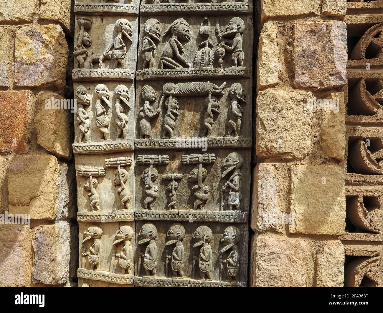 A traditional Dogon house with a finely carved door, Mali Stock Photo ...