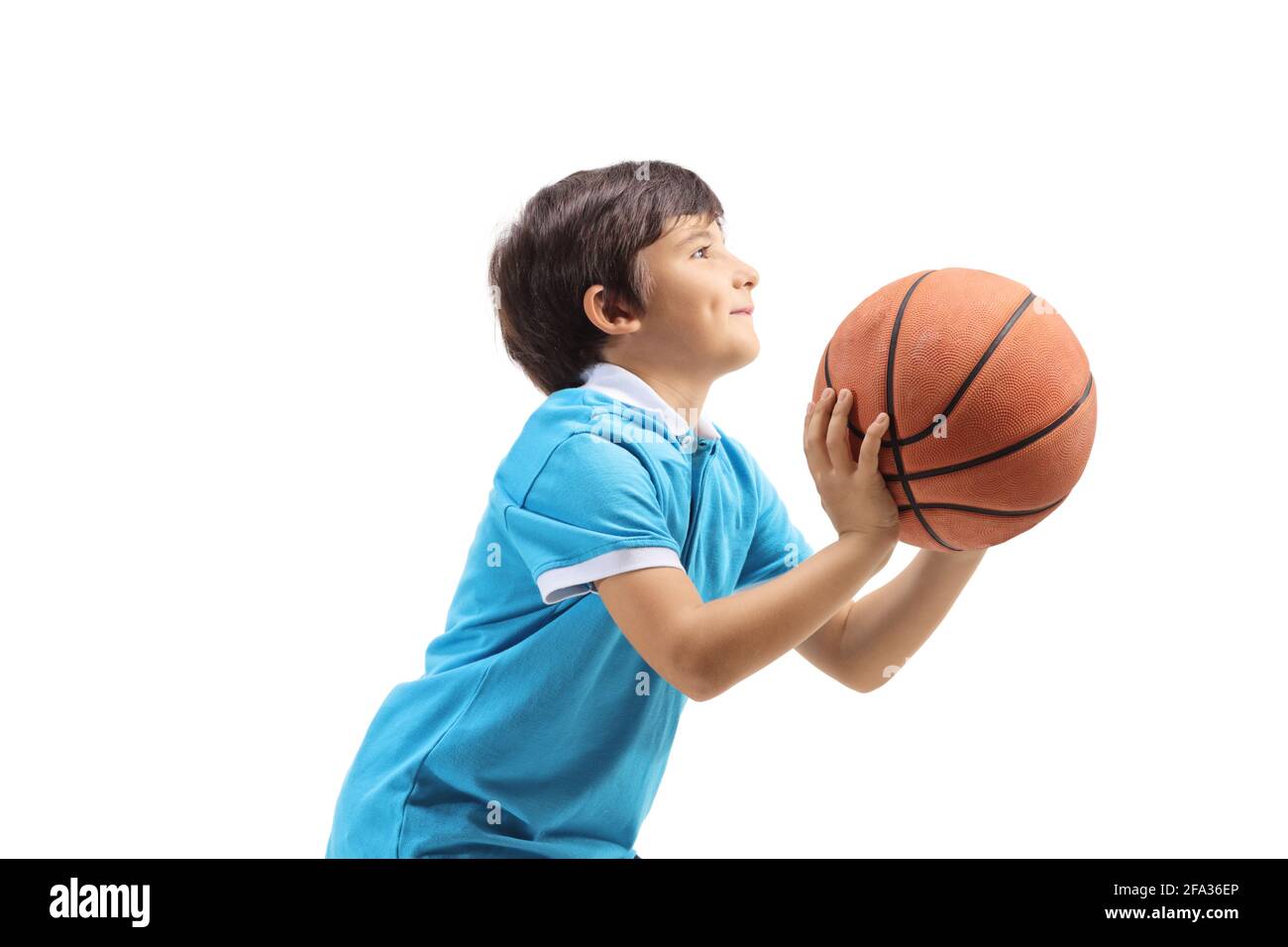 Boy throwing a basketball isolated on white background Stock Photo - Alamy