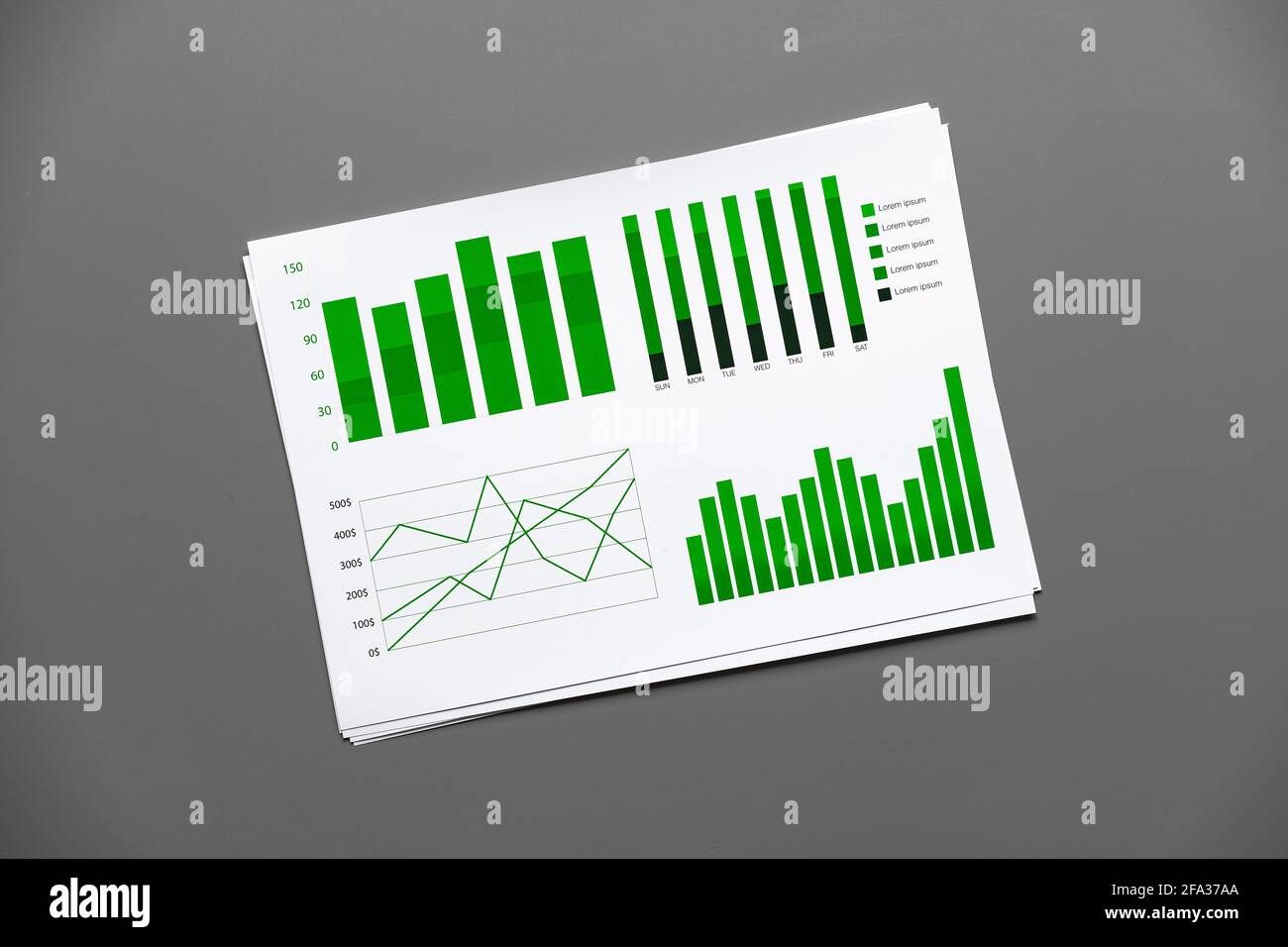 Financial paper with charts and diagrams on gray table Stock Photo - Alamy