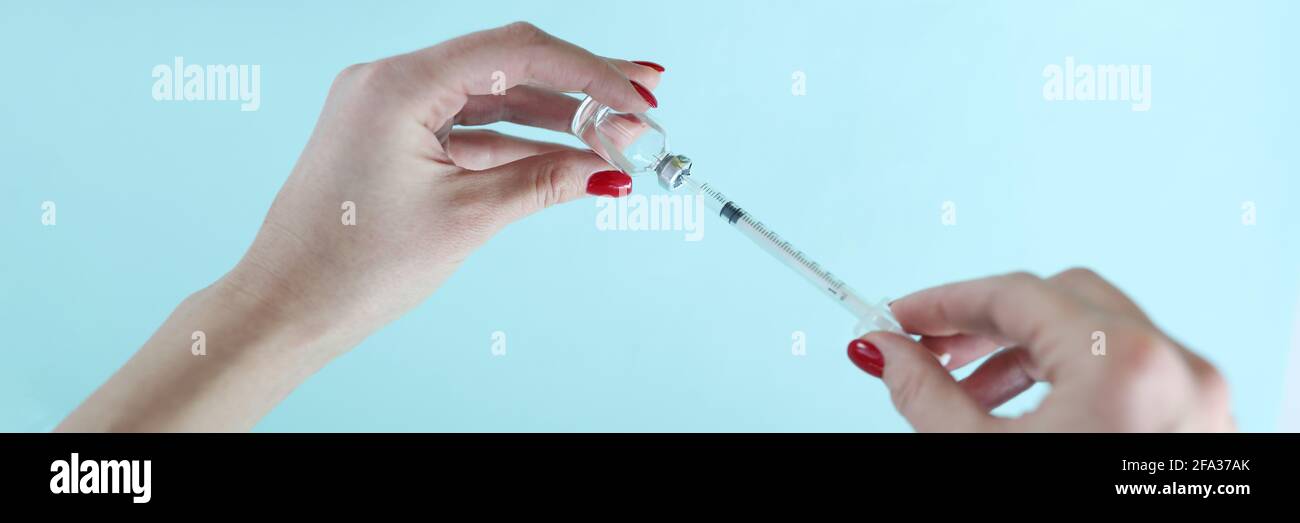 Female hands are taking medicine with syringe from bottle closeup Stock ...
