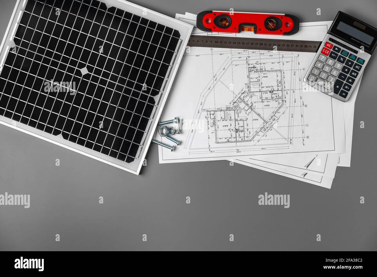 Architectural blueprints and solar panel on table Stock Photo - Alamy