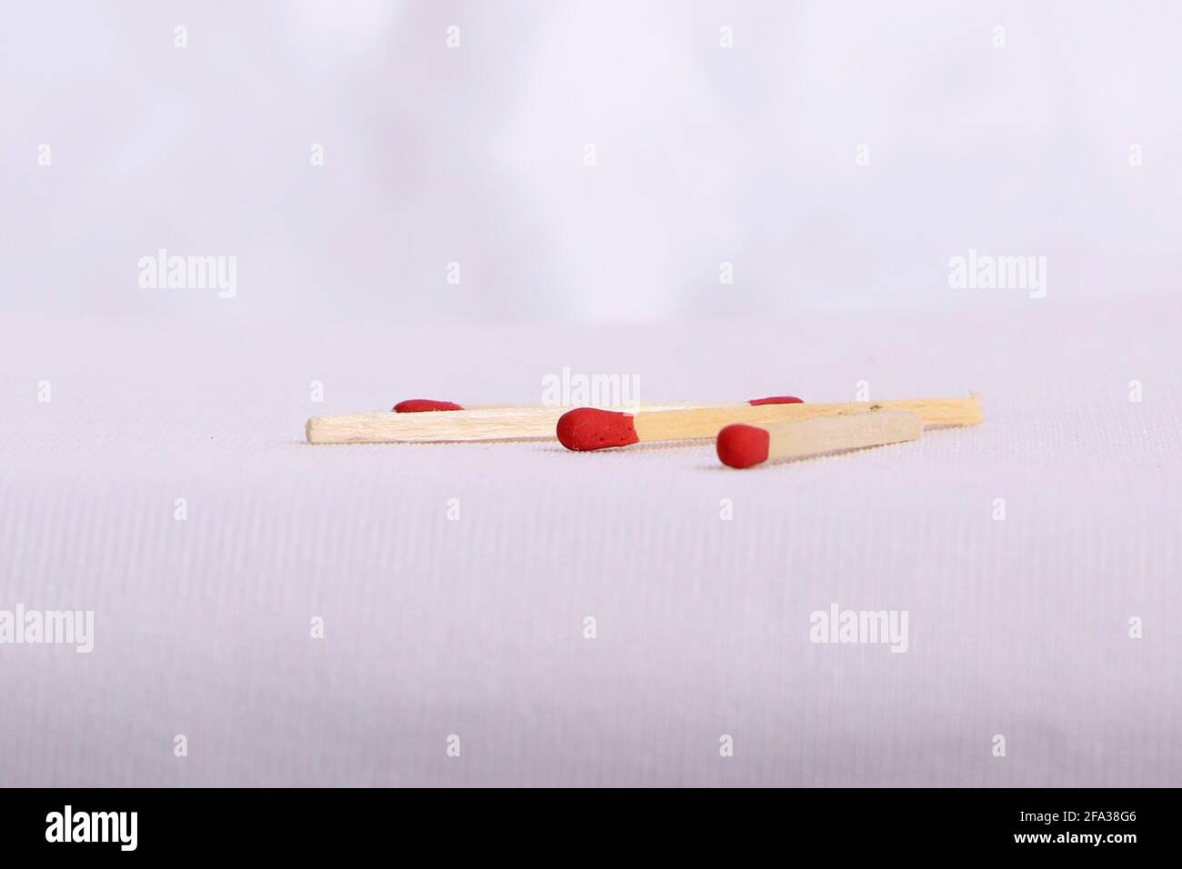 Pile of matches on white background Stock Photo - Alamy