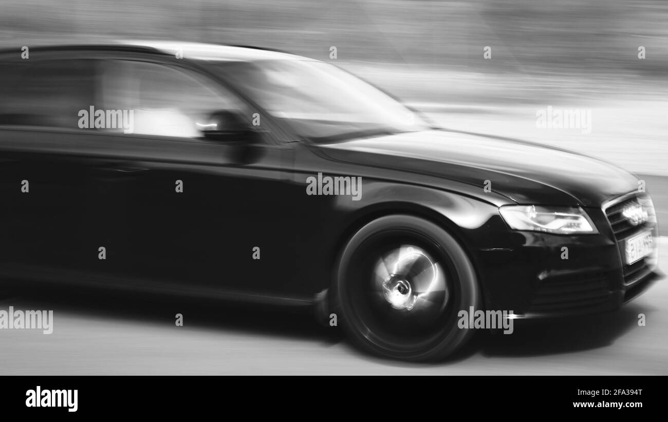 Car driving slow Black and White Stock Photos & Images - Alamy