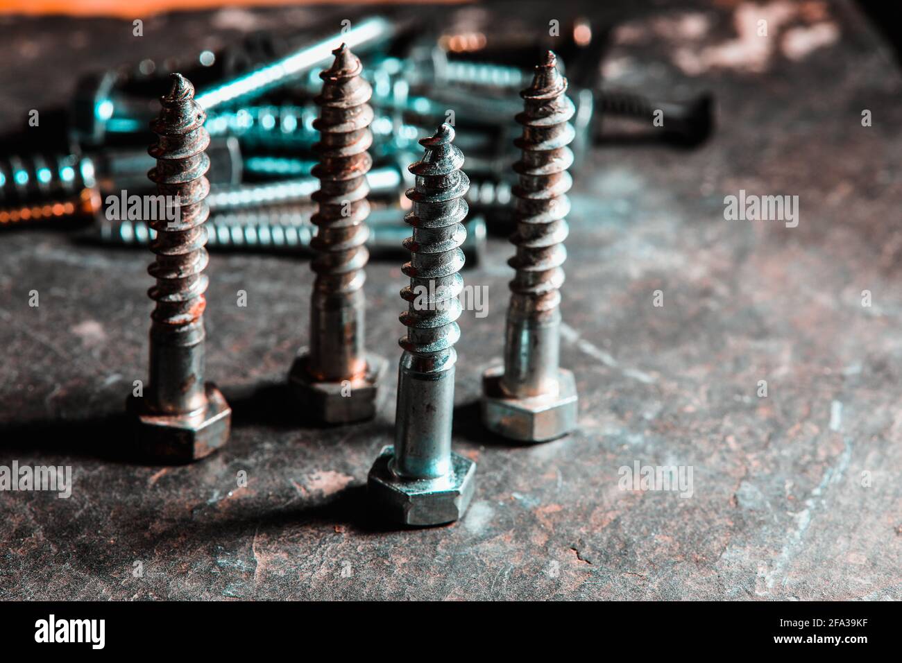 Different Kind of Screws on a table in a workshop Stock Photo - Alamy