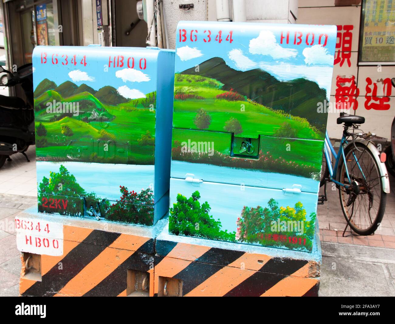 A set of electric transformer utility covers colorfully painted to look ...