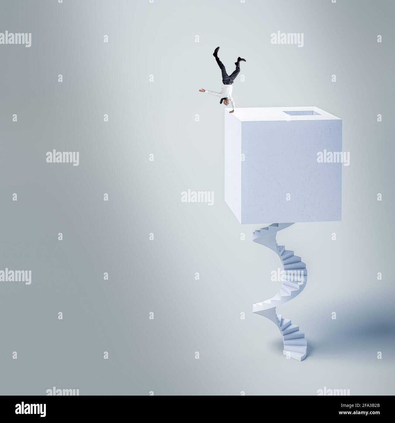 man balancing on one hand above an abstract ladder structure. safety ...