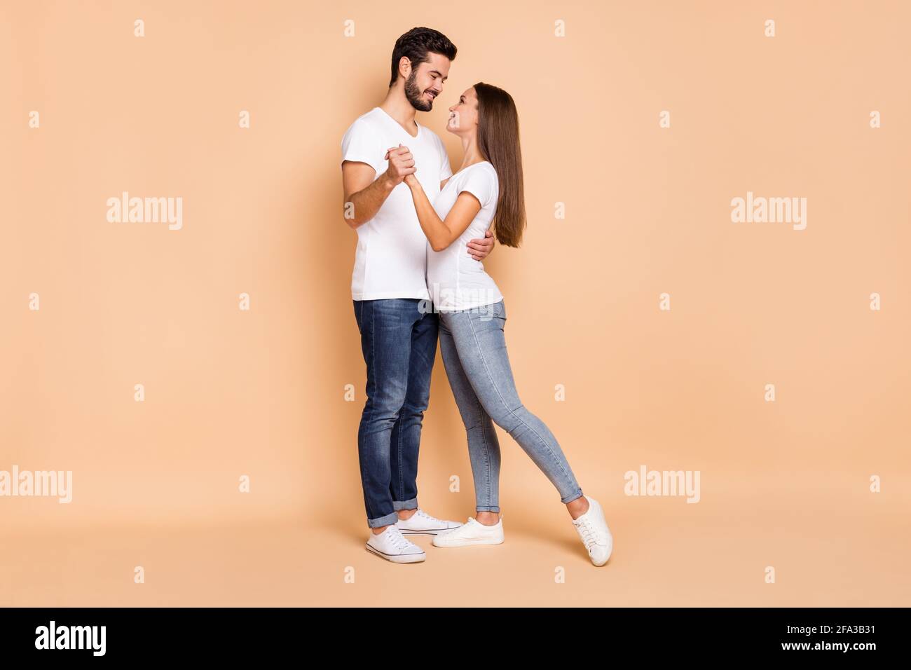 Full body profile side photo of young couple happy positive smile hug ...