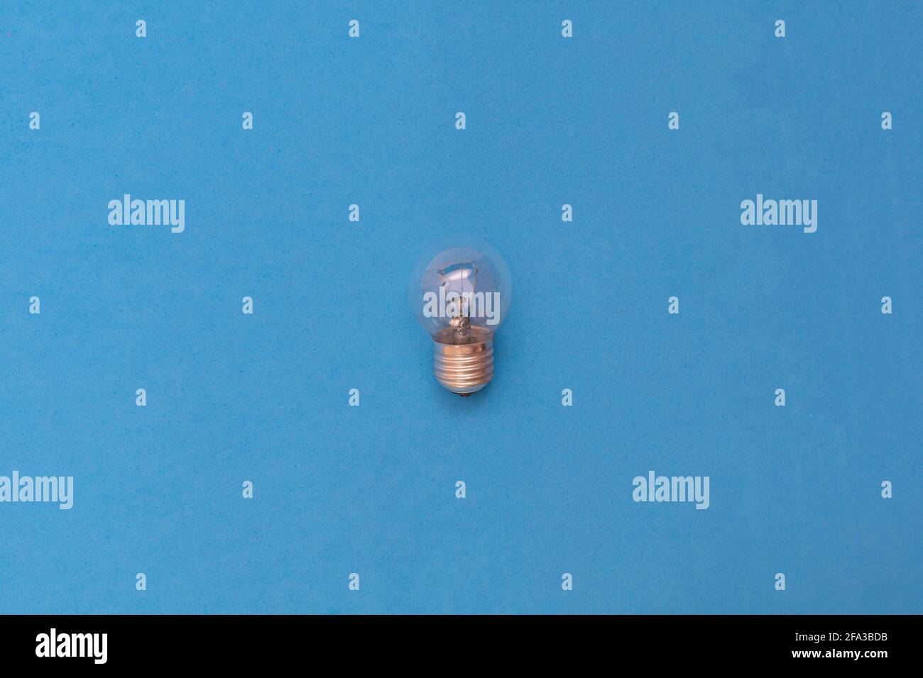 tungsten bulb on blue background concept idea thinking startup business ...