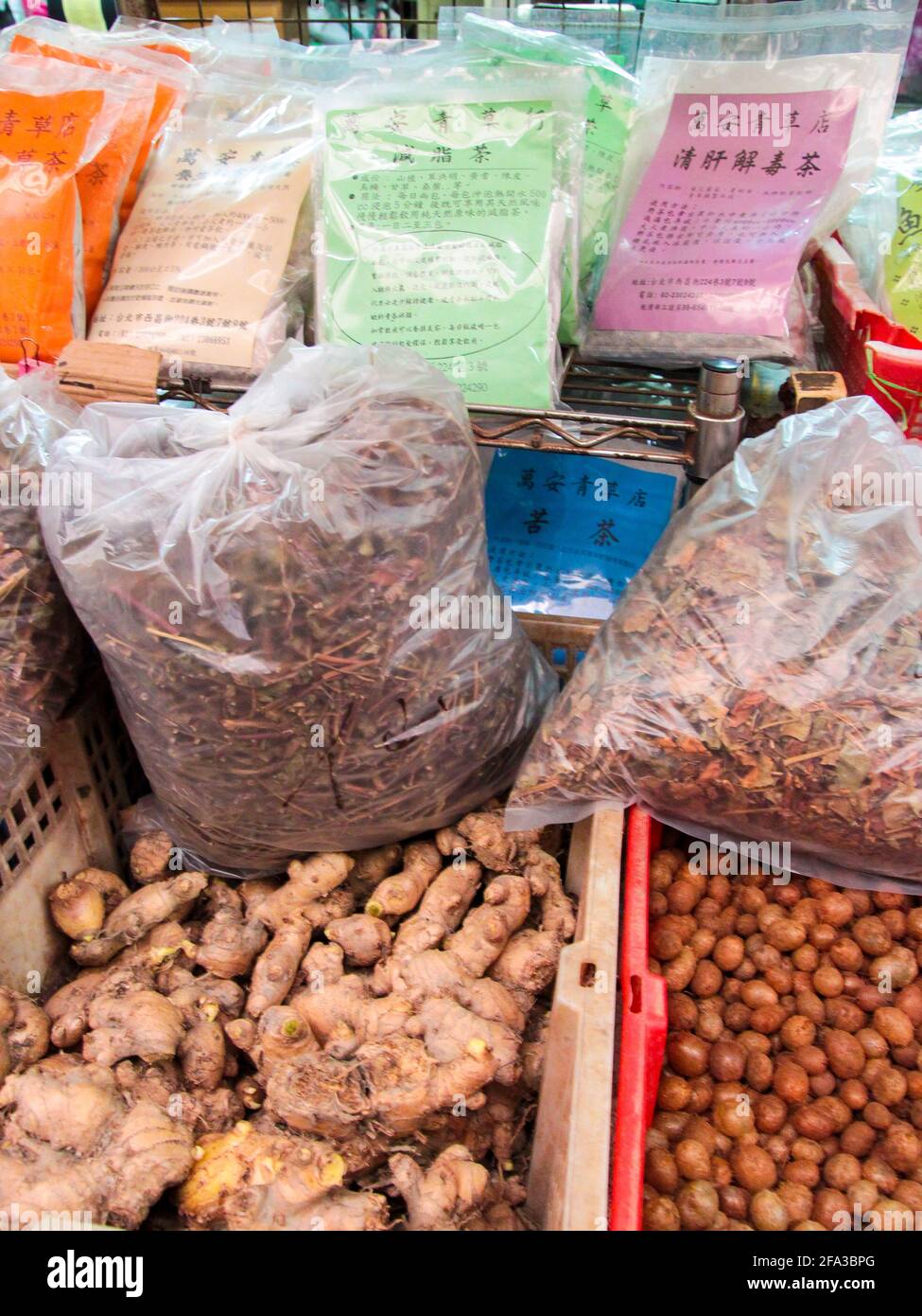 Ginger, bags of dried leaves and other foods, medicine ingredients. At ...