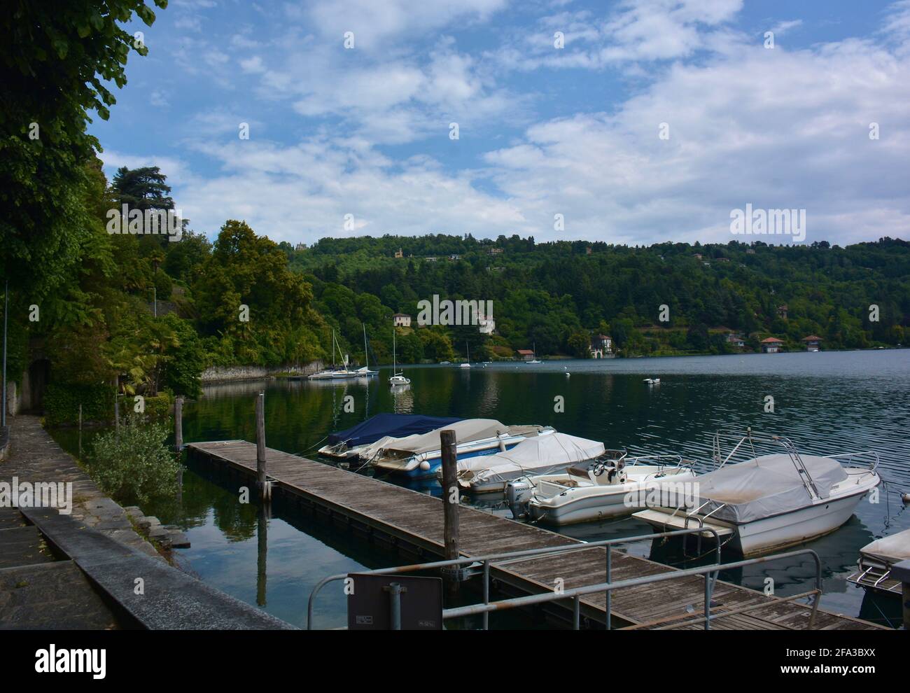 Lake Orta with boats by the port Stock Photo - Alamy