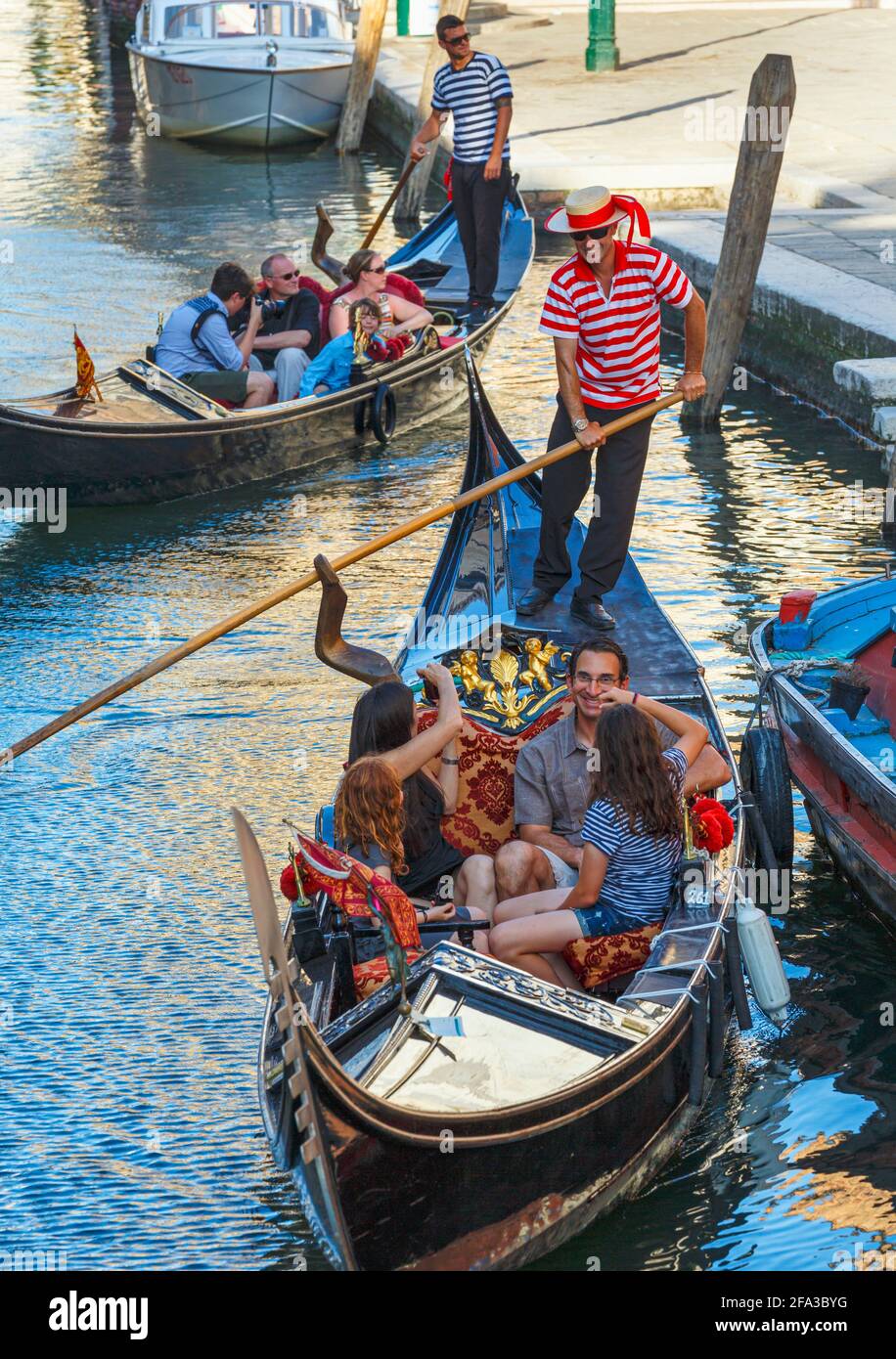 Venice, Venice Province, Veneto Region, Italy. Gondola ride. Gondolas ...