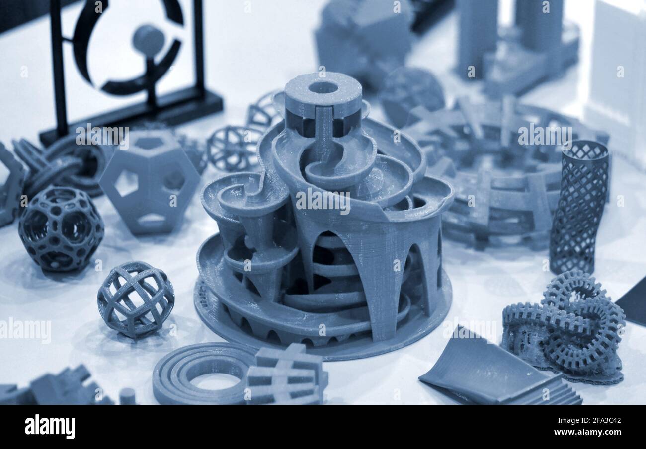 Models printed by 3d printer. Bright colorful objects printed on a 3d ...