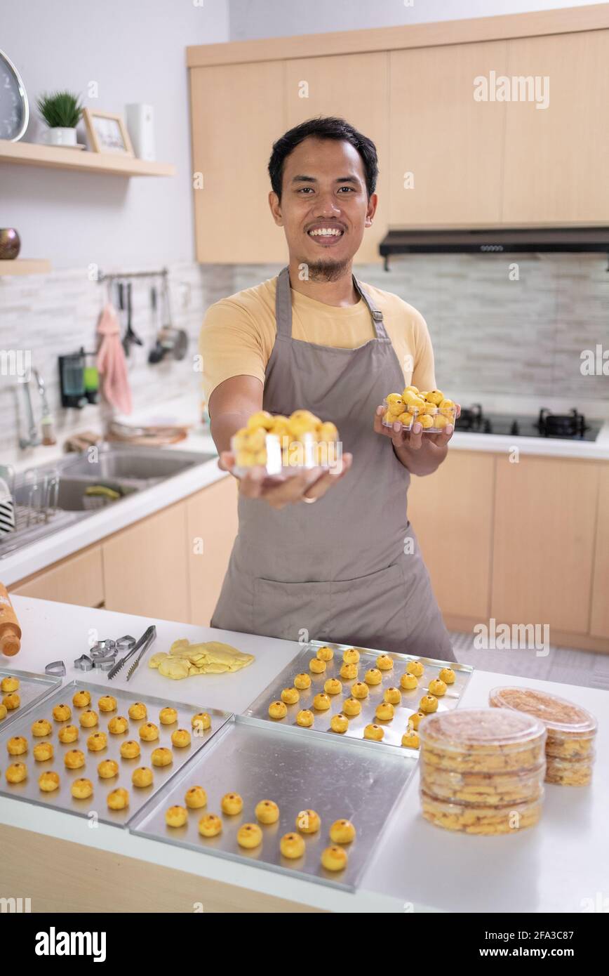 asian young man with his cooking smiling Stock Photo - Alamy