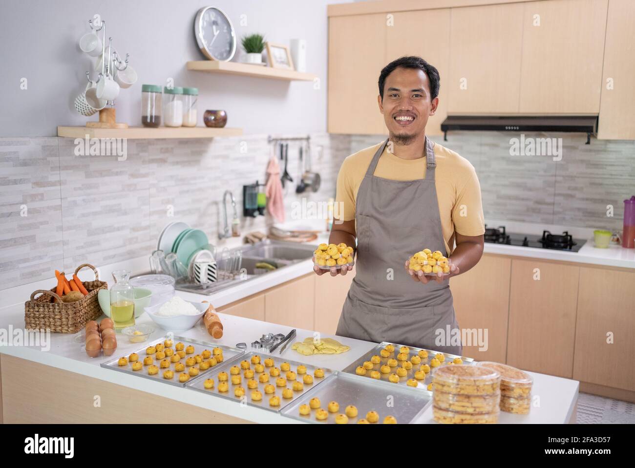 asian young man with his cooking smiling Stock Photo - Alamy