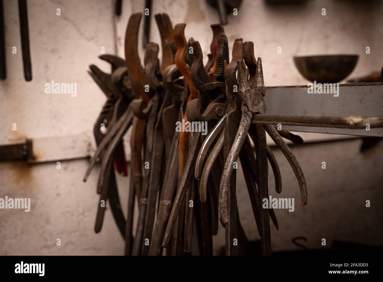 Tools for forging in a blacksmith shop. Pliers Stock Photo - Alamy