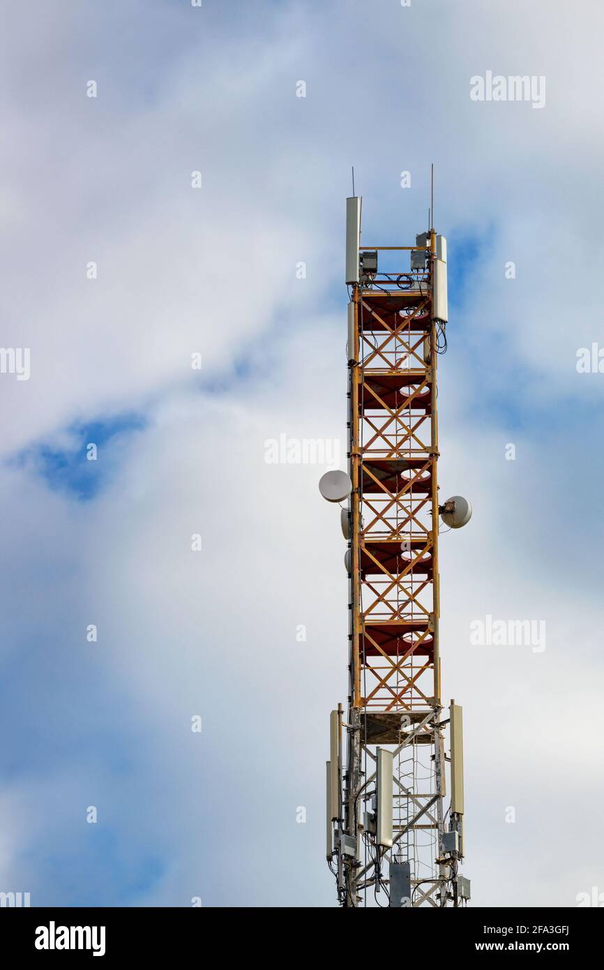 A metal tower with antennas for mobile cellular and satellite ...