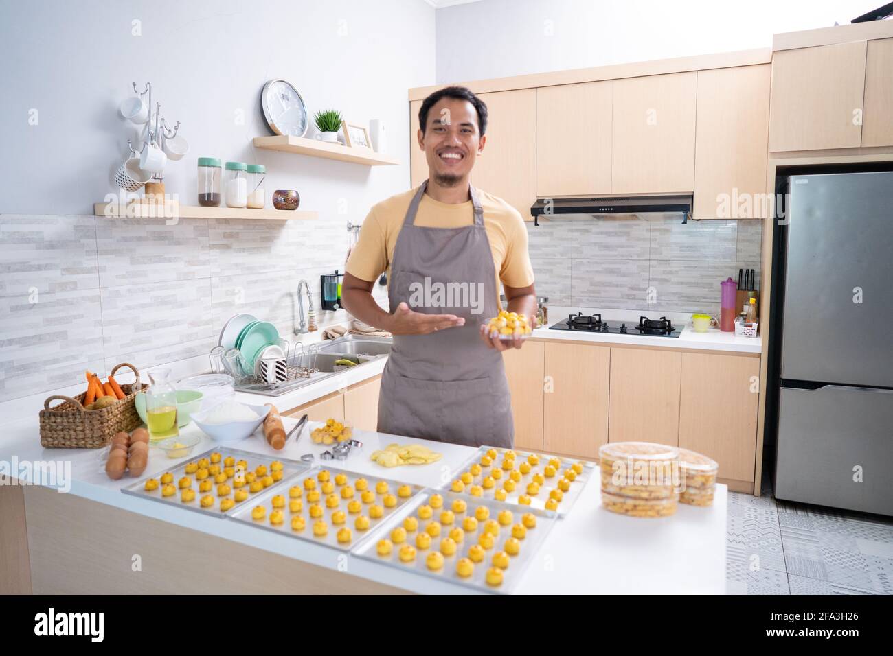 asian young man with his cooking smiling Stock Photo - Alamy
