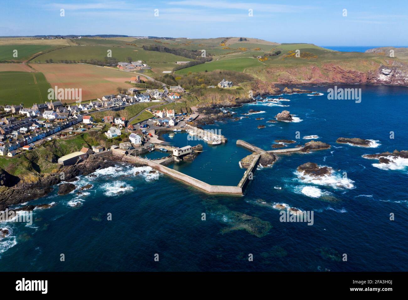 Aerial view of St Abbs historic fishing village on the Berwickshire ...