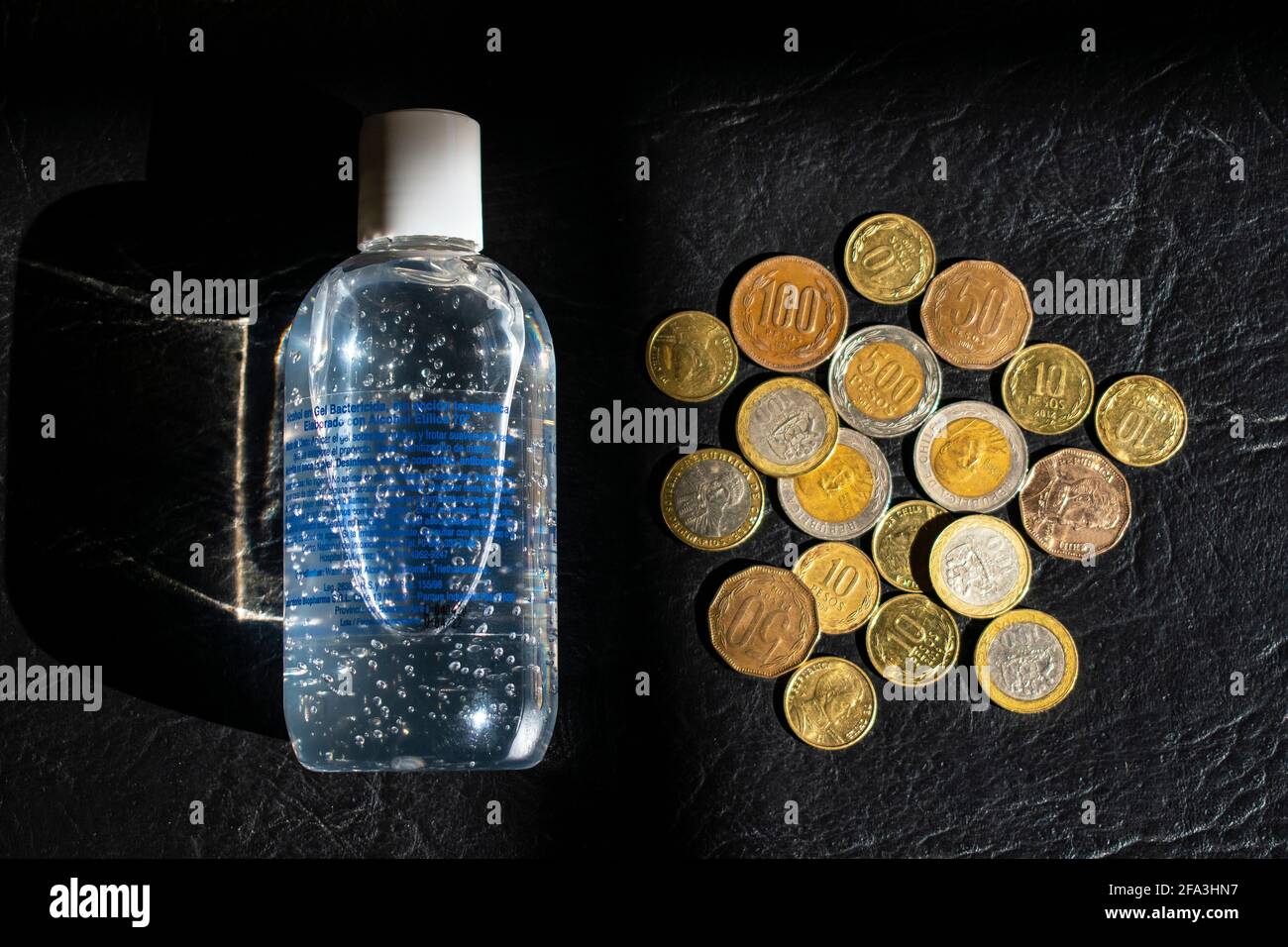 Gel alcohol and cash (coins Stock Photo - Alamy