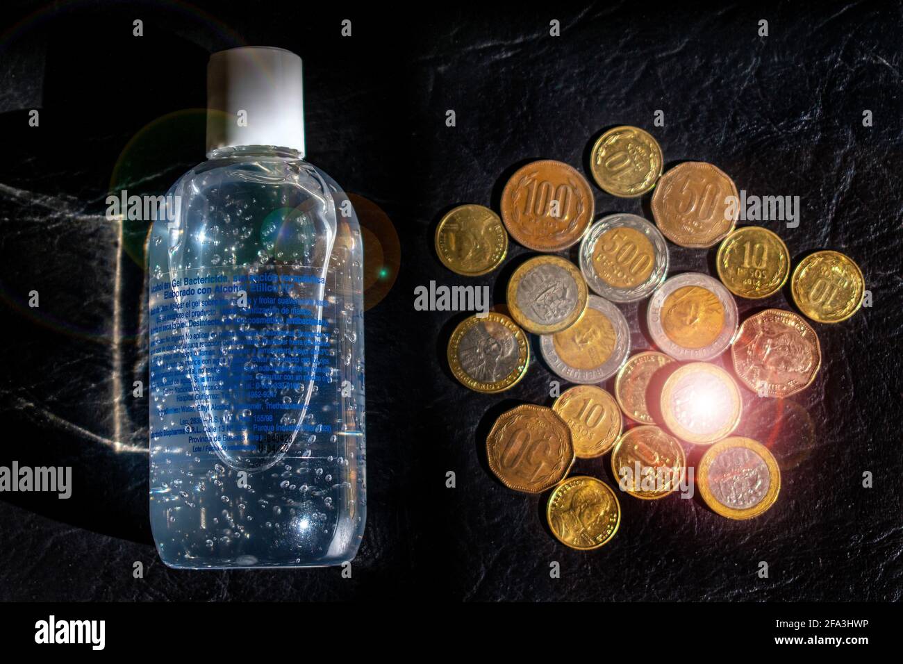 Gel alcohol and cash (coins Stock Photo - Alamy