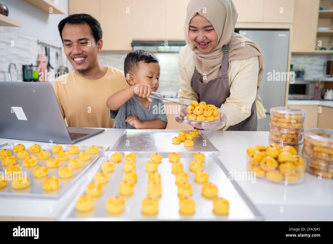 muslim family cooking nastar tart at home Stock Photo - Alamy