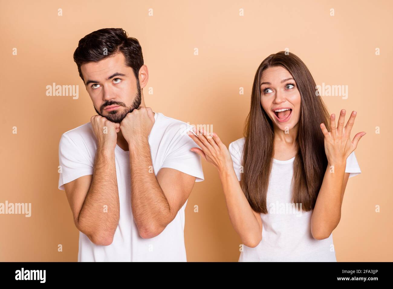 Photo of stressed quarrel married couple dressed white t-shirt looking ...