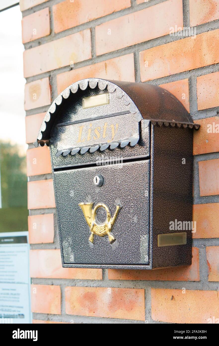POZNAN, POLAND - Sep 13, 2015: Mail box with symbol hanging on a brick ...