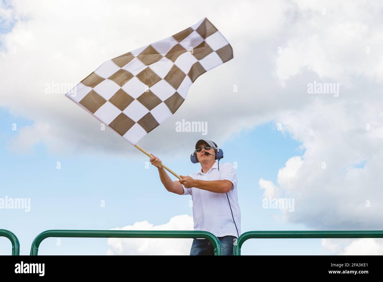 Man waving checkered flag hi-res stock photography and images - Alamy