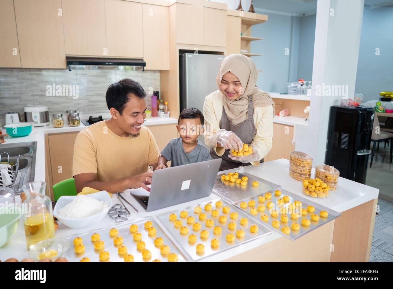 muslim family cooking nastar tart at home Stock Photo - Alamy