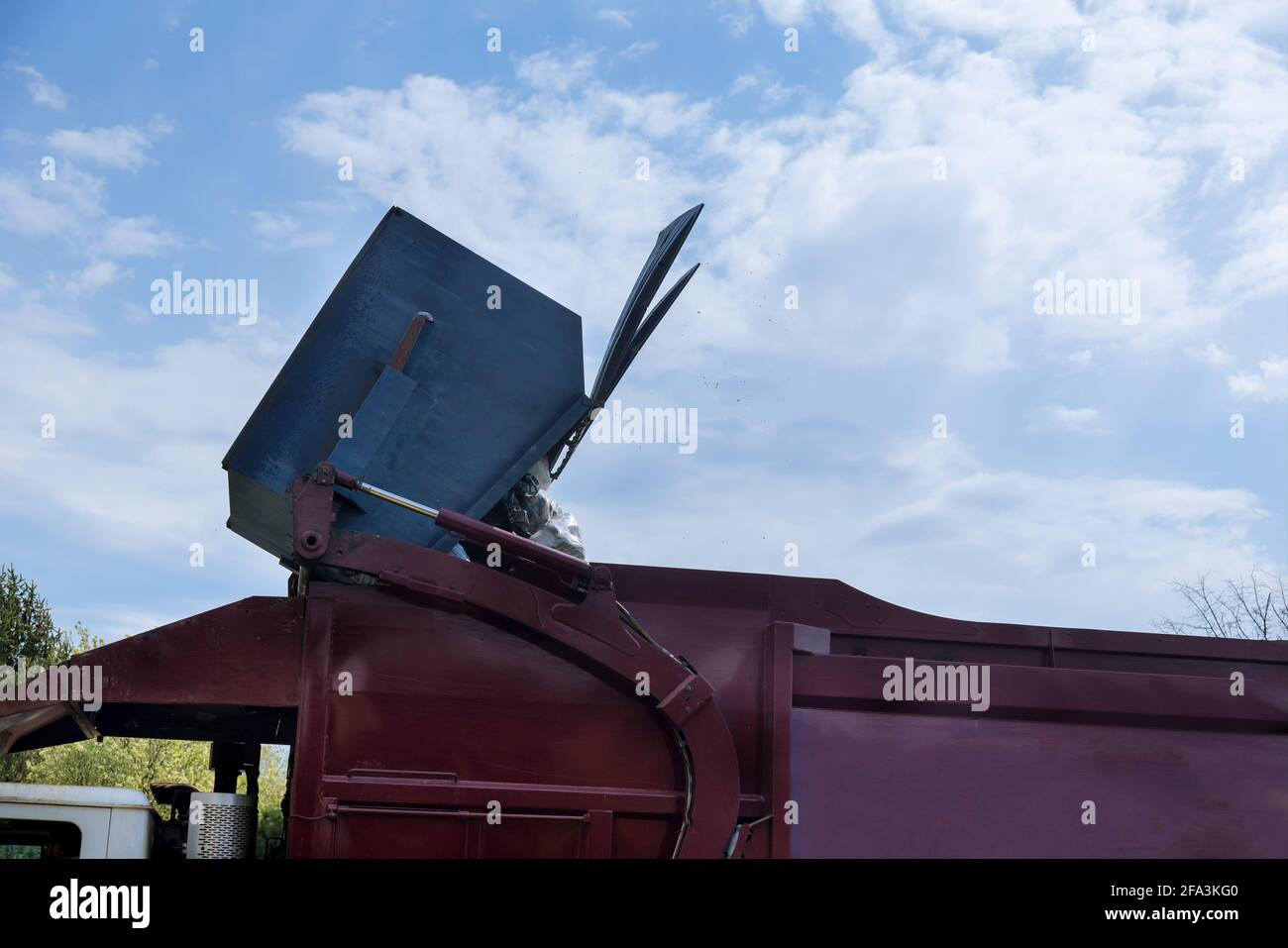Garbage is loaded into the car the disposal of municipal waste using a ...