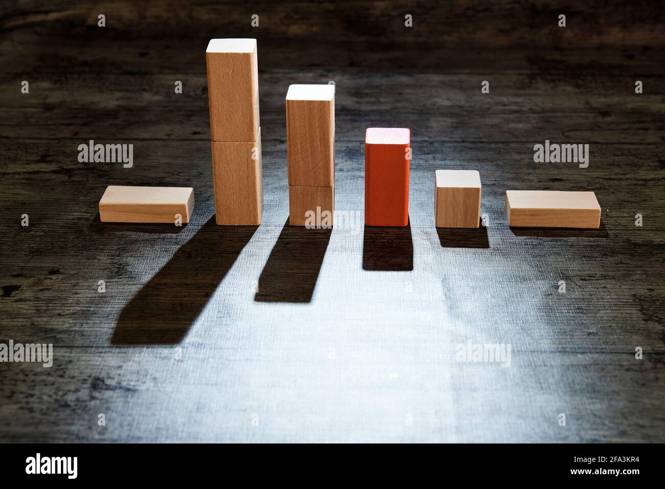 Set of wooden blocks in the form of a weakening graph with a red block ...