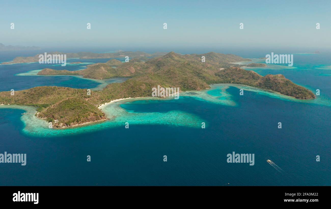 aerial drone tropical islands with blue lagoons, coral reef and sandy ...