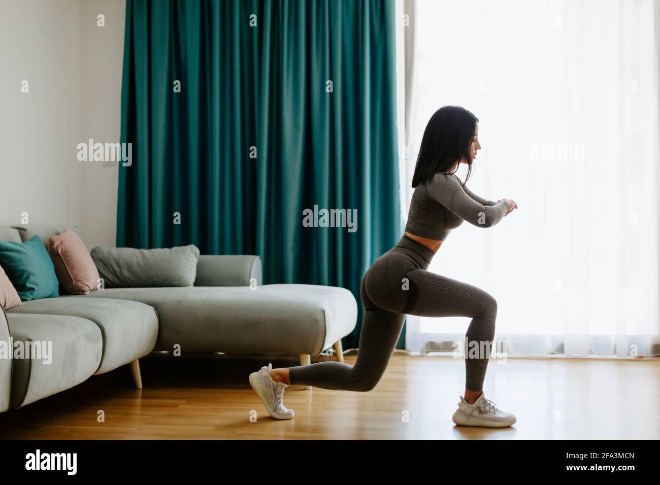 Athletic woman legs lunges workout at home, squats. Home workout Stock ...