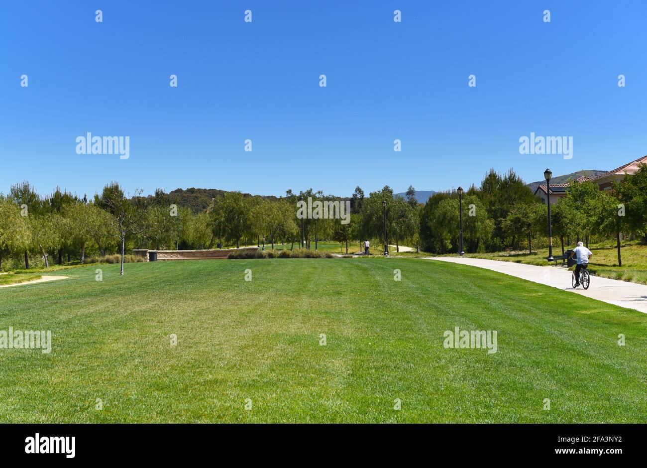 IRVINE, CALIFORNIA - 19 APR 2021: Cyclists on the Jeffrey Open Space ...